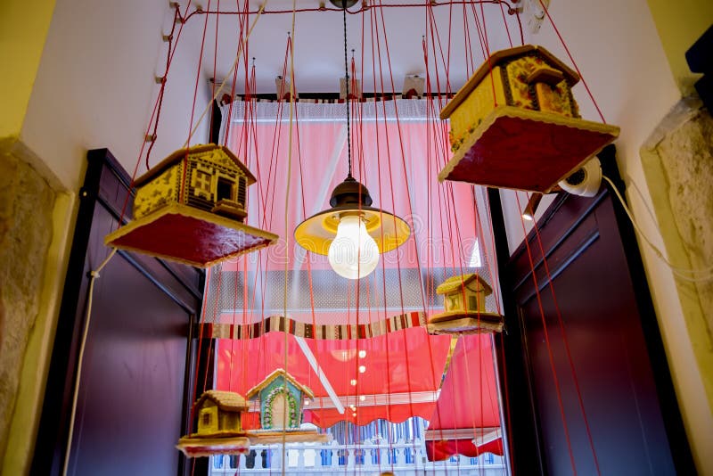 Gingerbread House Hanging on a String Around a Light Bulb. Stock Photo ...