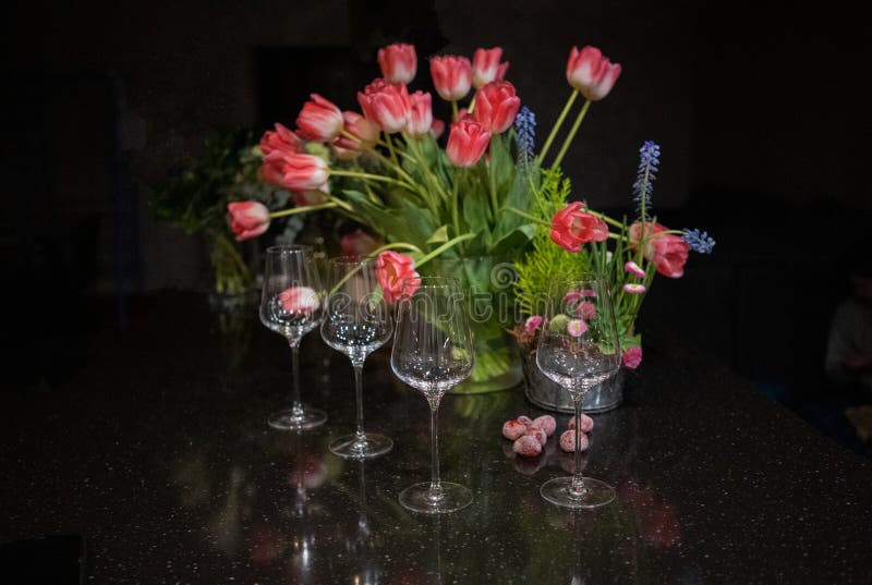 Decoration with Tulips and Vine Glasses on the Table Stock Photo ...