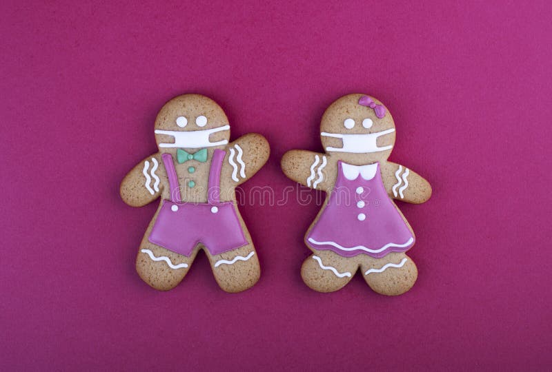 Decorations for the Christmas Tree Two Gingerbread Men with a Mask on ...