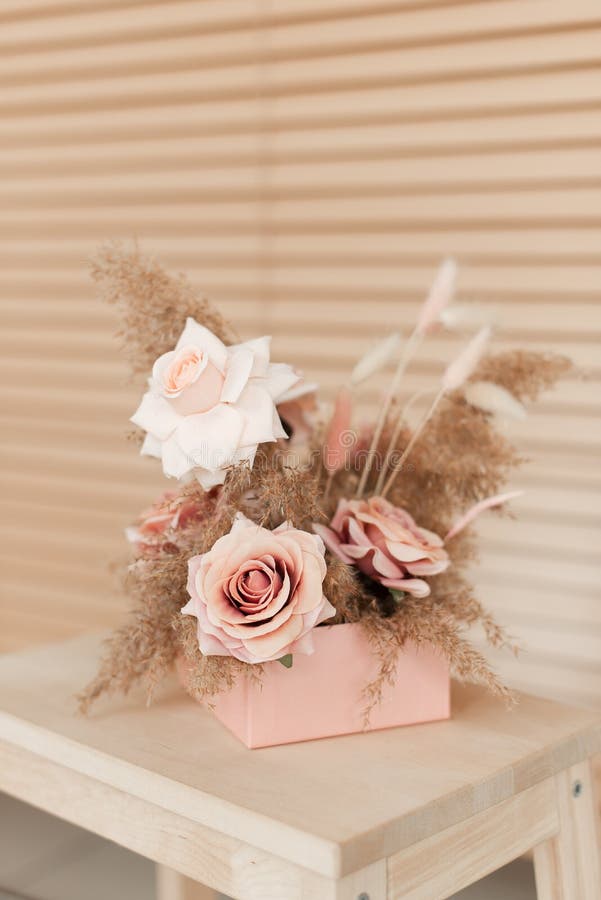 Decorative Artificial Flowers in a Pink Box on the Table Stock Image ...
