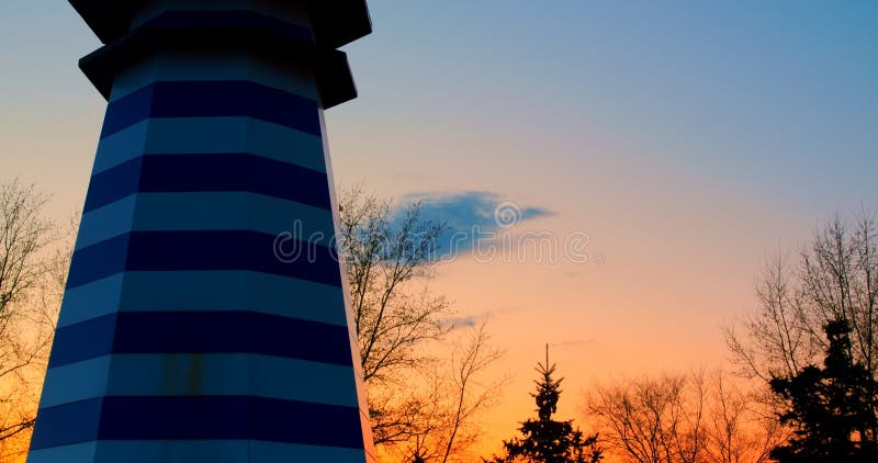 Decorative Blue and White Striped Lighthouse Isolated on White ...