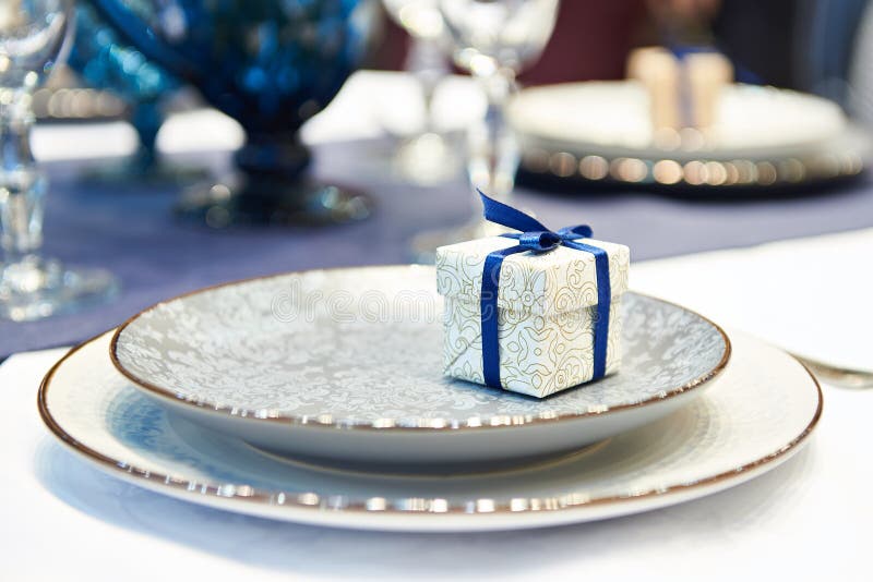 Decorative Box with Gift on Plate of Festive Table Stock Image - Image ...