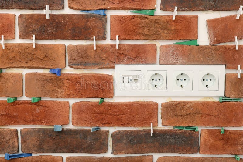 Decorative Bricks with Tile Leveling System on Wall Stock Image - Image ...