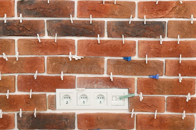 Decorative Bricks with Tile Leveling System on Wall Stock Photo - Image ...