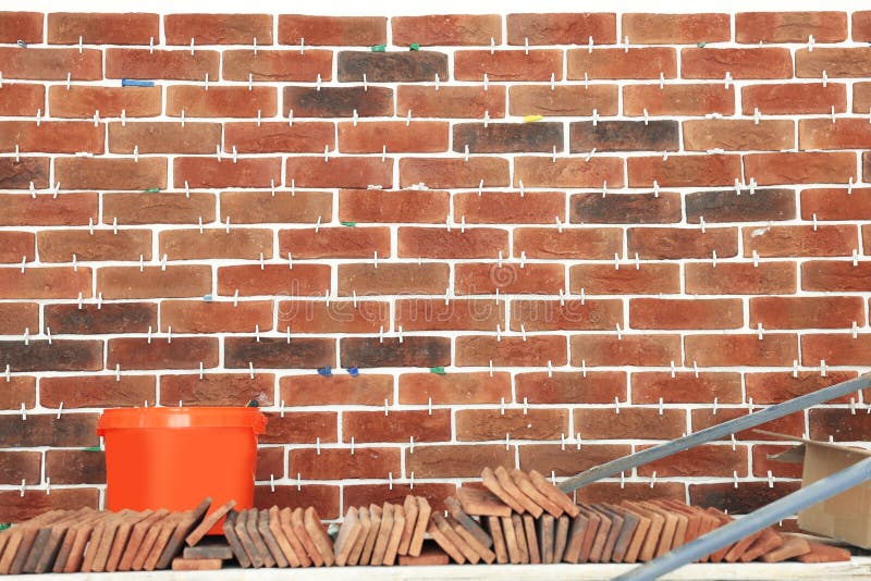 Decorative Bricks with Tile Leveling System on Wall Stock Photo - Image ...