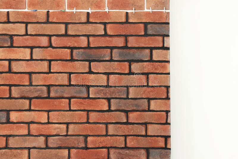 Decorative Bricks with Tile Leveling System on White Wall Stock Image ...