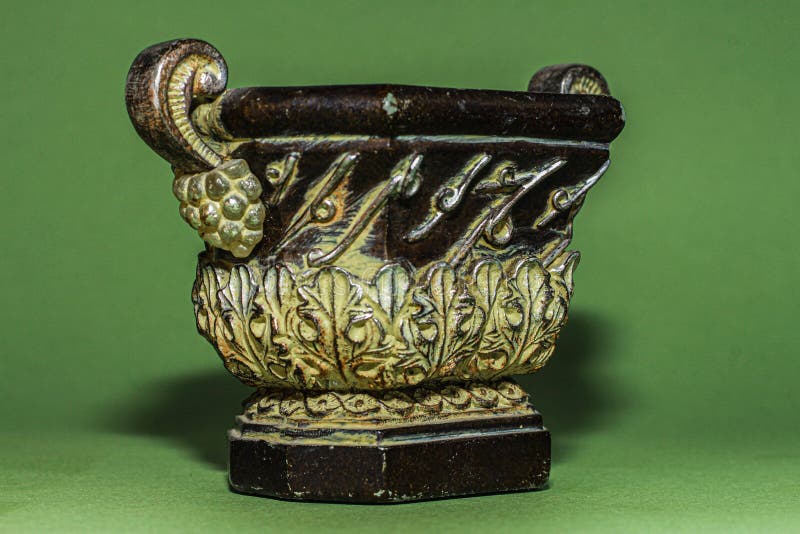 Decorative Bronze Cup with Patterns on a Green Background Stock Image ...