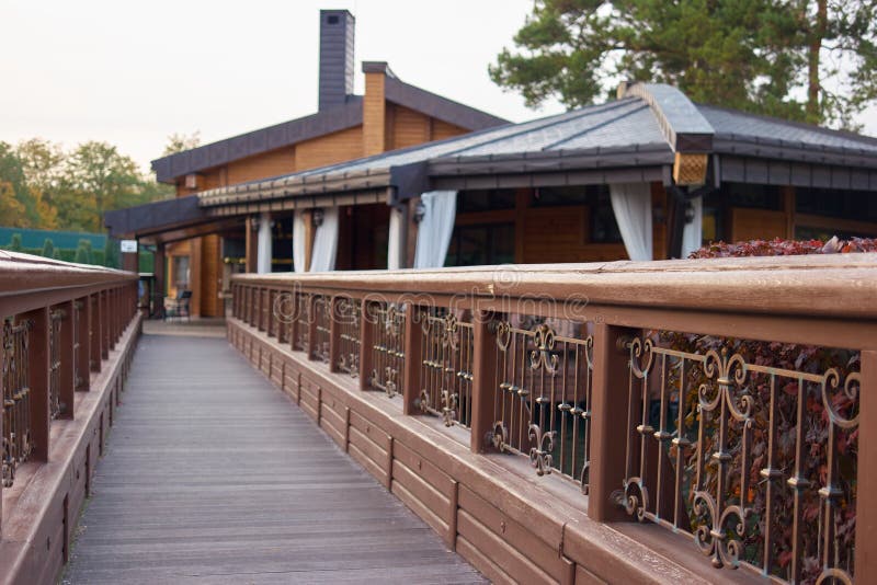 Decorative Brown Railing of a Bridge Leading To a Restaurant. Stock ...
