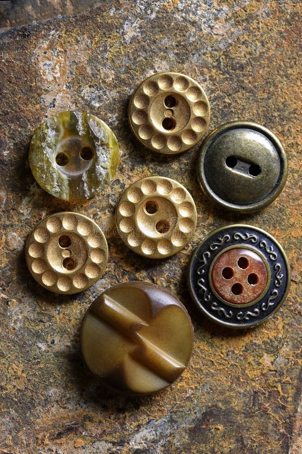 Decorative Buttons on a Flat Stone Slab Stock Image - Image of earthy ...
