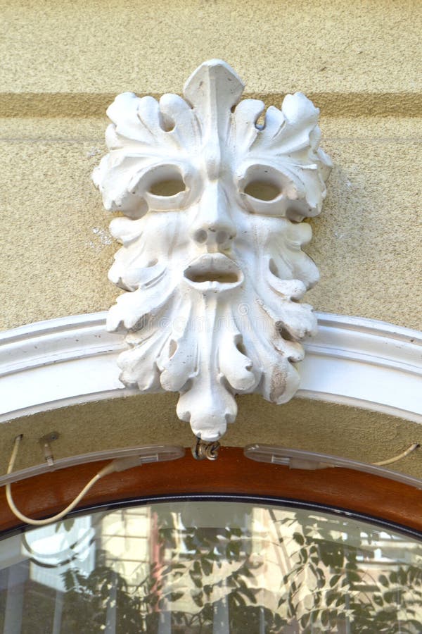 Decorative Carved Face on Building Facade Stock Image - Image of ...