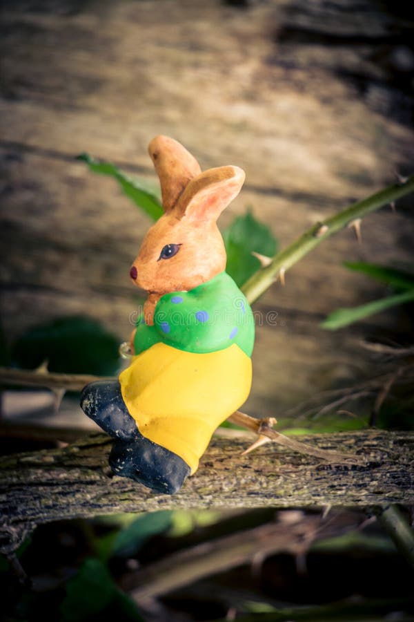 Decorative Ceramic Rabbit on a Branch of a Plant in a Garden Stock ...