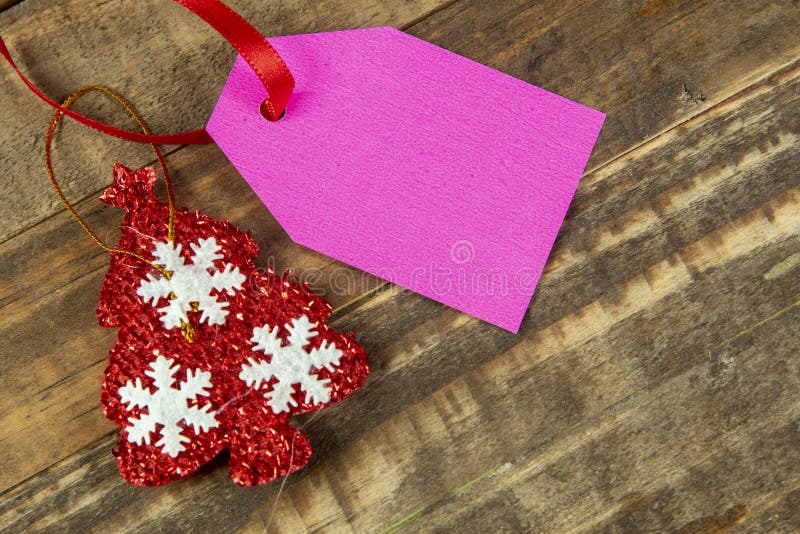 Decorative Christmas Elements Next To Card with Red Ribbon and Space To ...