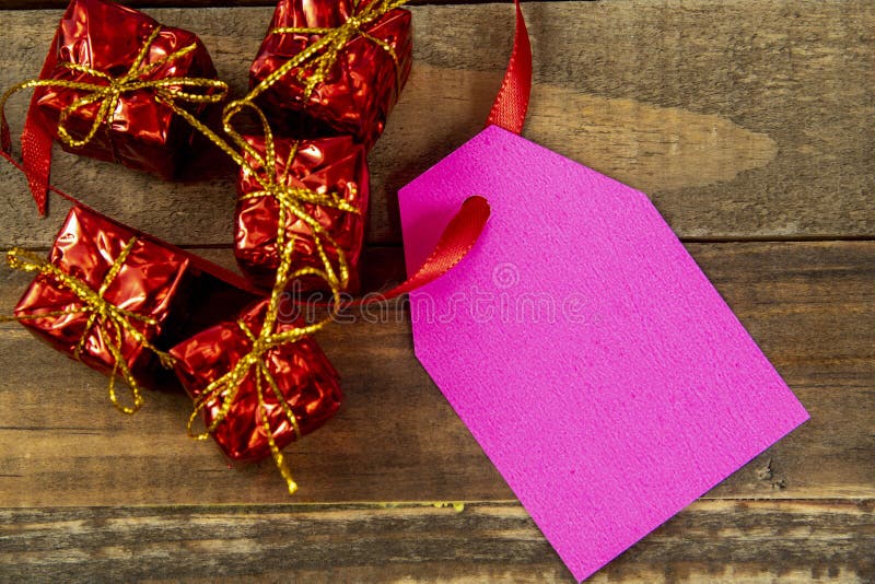 Decorative Christmas Elements Next To Card with Red Ribbon and Space To ...