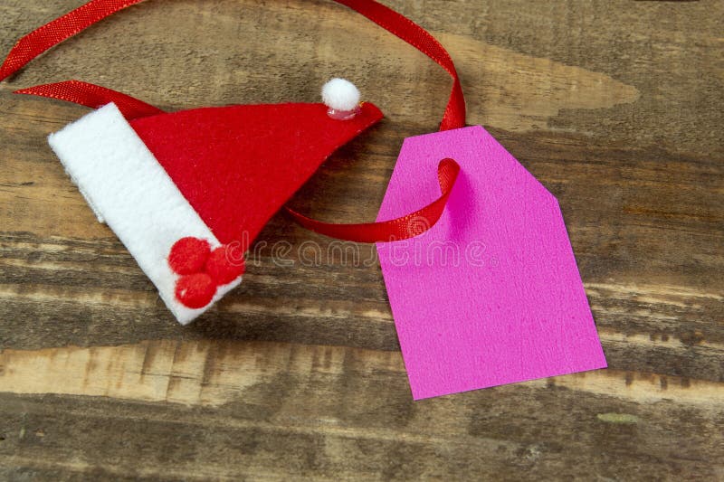 Decorative Christmas Elements Next To Card with Red Ribbon and Space To ...