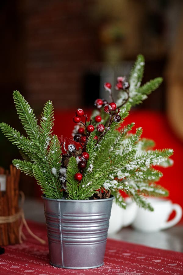 Decorative Christmas Tree with Red Berries in the Interior in an Iron ...