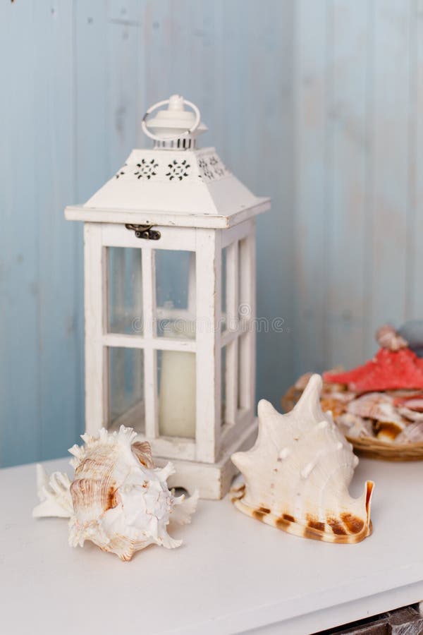 Lantern and seashells stock photo. Image of lantern - 140838480