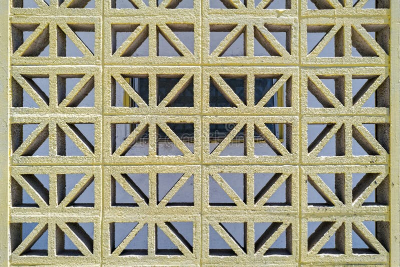 A Decorative Concrete Block Divider Wall with a Repeating Geometric ...