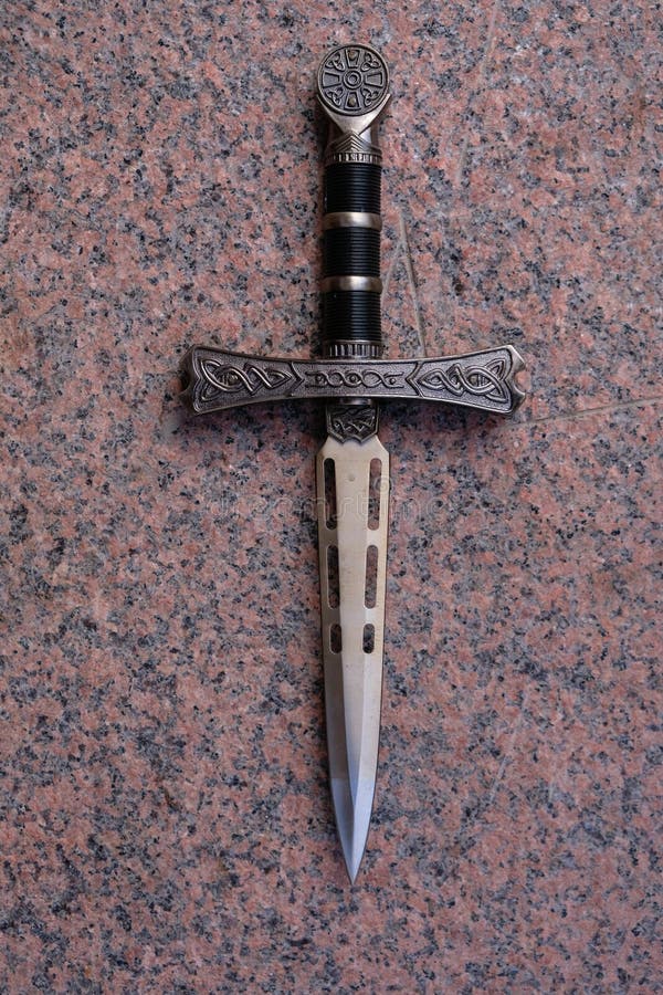 Decorative Dagger Knife on a Granite Background. Stock Image - Image of ...