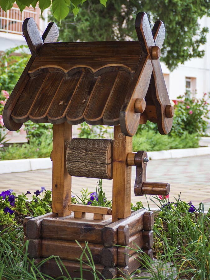 Decorative Element of the Garden. Wooden Decorative Well with a Pattern ...