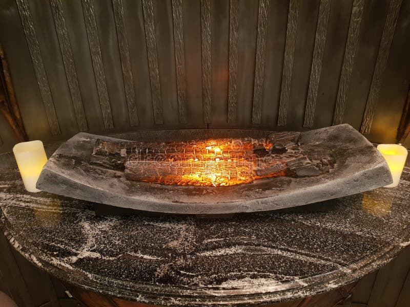 Decorative Fireplace with Mock-up. Artificial Fire on Wood Stock Image ...