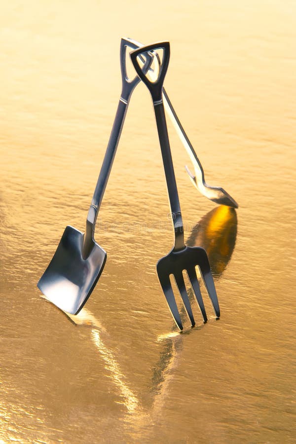 Decorative Fork and Spoons in the Form of Spades on a Golden Background ...