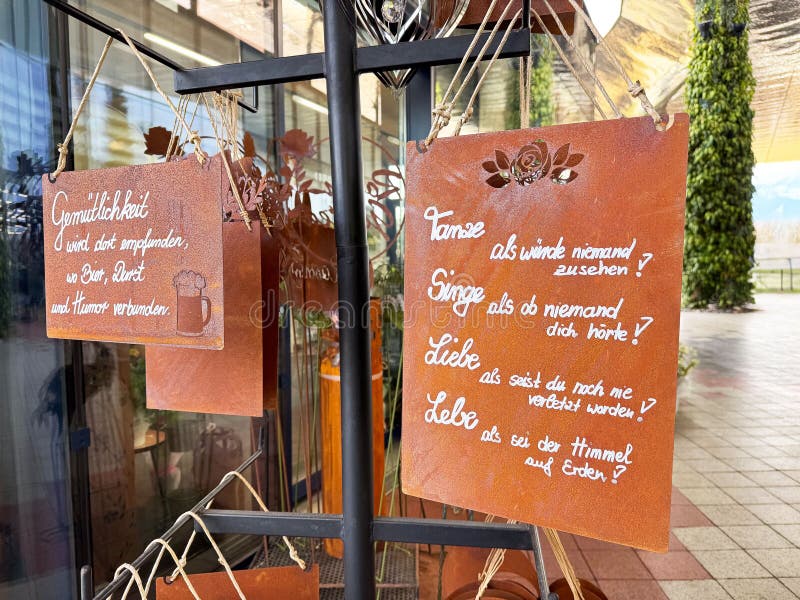 Decorative German Signs with Motivational Quotes in Outdoor Setting ...
