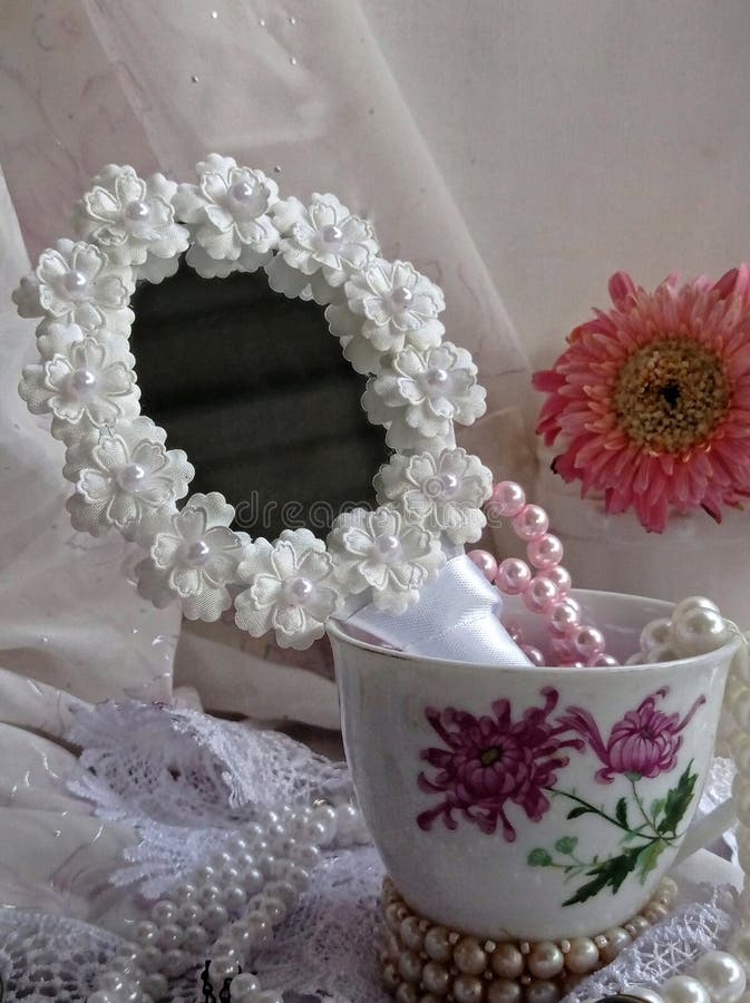 Decorative Hand Mirror in Empty Cup and Pearl Necklace Stock Image ...