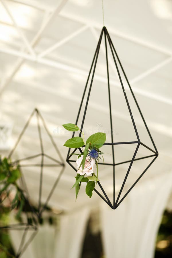 Decorative Hanging Cages with Fresh Flowers. Event Flowers Decoration ...