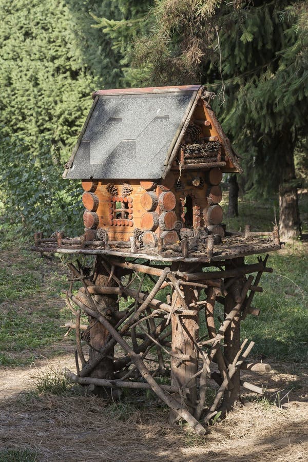 Decorative House Made of Pine Logs, Branches and Cones in the Park ...