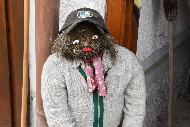 A Decorative Interessting Looking Straw Puppet with a Cap and a Knit ...