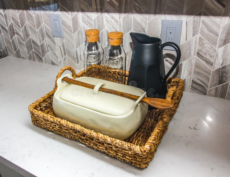 Decorative Items in Wicker Basket on Kitchen Counter Stock Photo ...