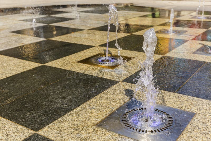 Decorative Jet Fountain on the Square Marble Stock Image - Image of ...