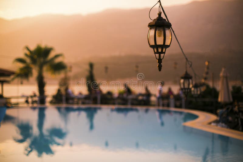Decorative Lamp Hanging on the Pool Stock Photo - Image of evening ...