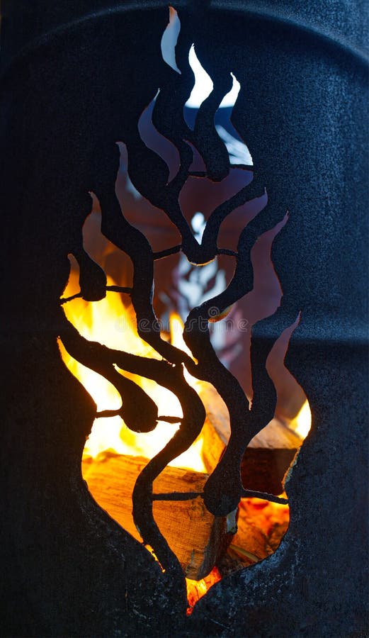Decorative Metal Fire Pit with Flame Cutouts Stock Photo - Image of ...