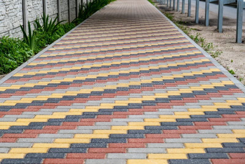 Decorative Paving Slabs of Different Colors Lined with a Snake Pattern ...