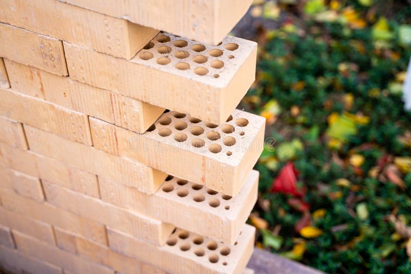 Decorative Perforated Bricks of Light Brown Color Stacked Close-up on a ...
