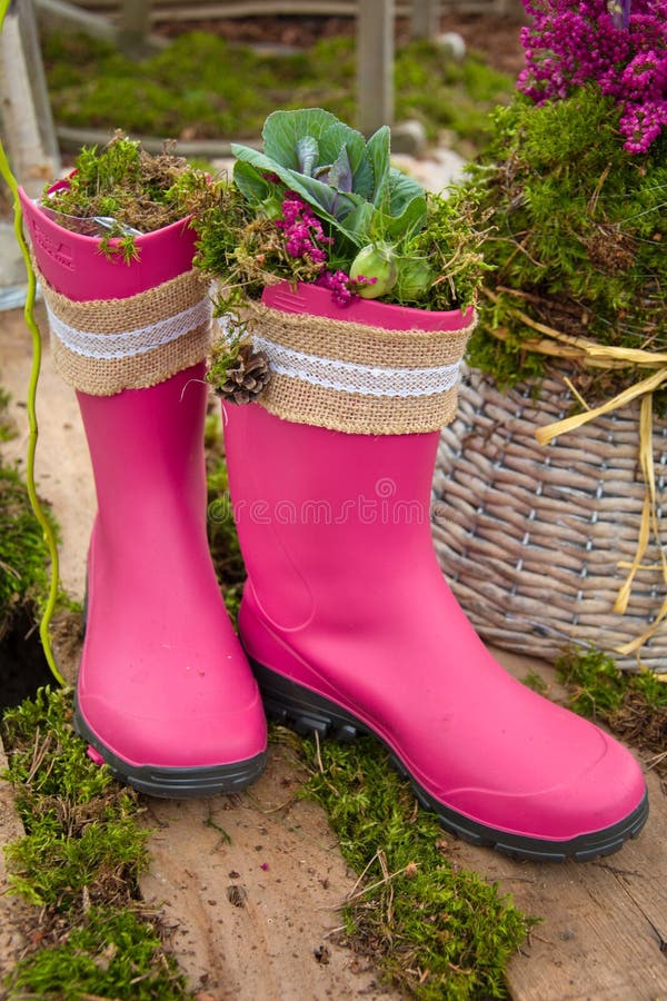 Decorative pink wellies stock image. Image of grass - 250899033