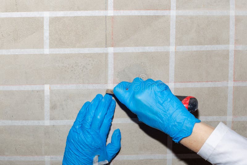 Decorative Plaster Bricks. a Woman Applies Markings To a Wall Using ...