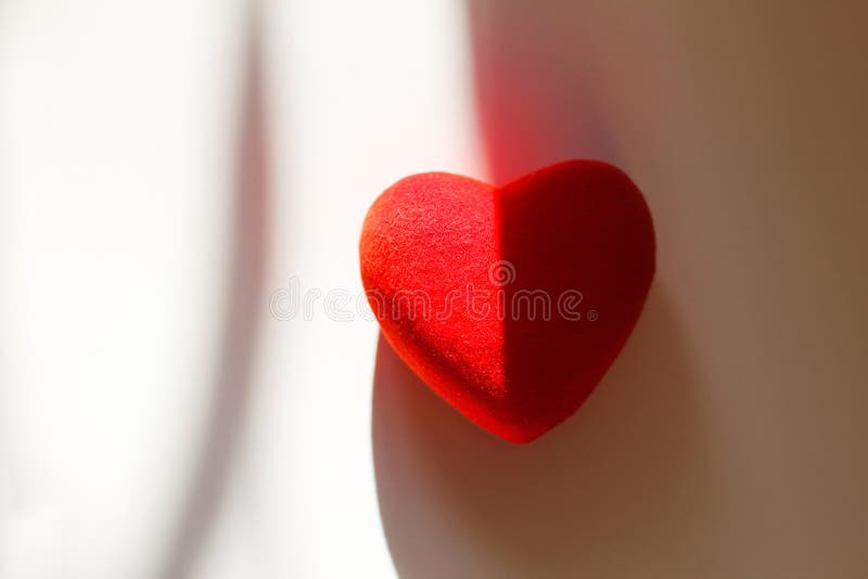 Decorative Red Heart on a White Background with Sun Rays and Shadow ...