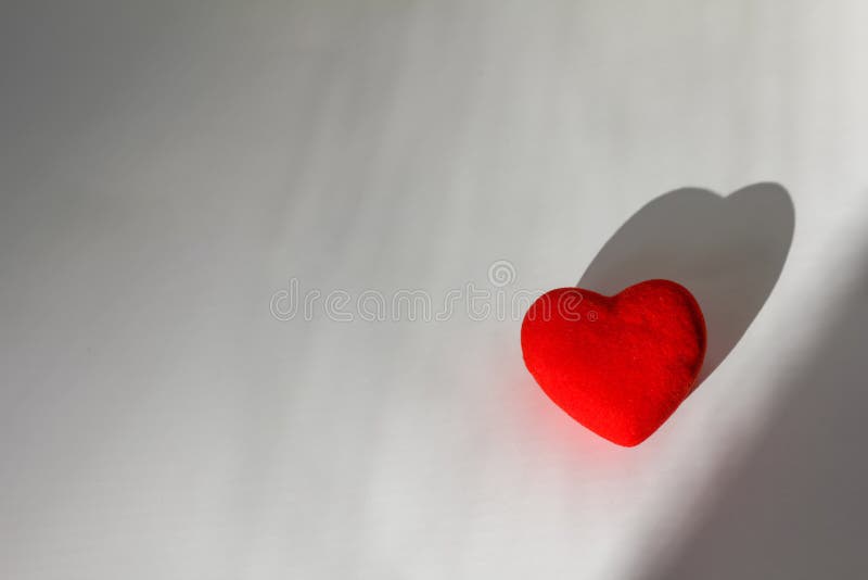 Decorative Red Heart on a White Background with Sun Rays and Shadow ...