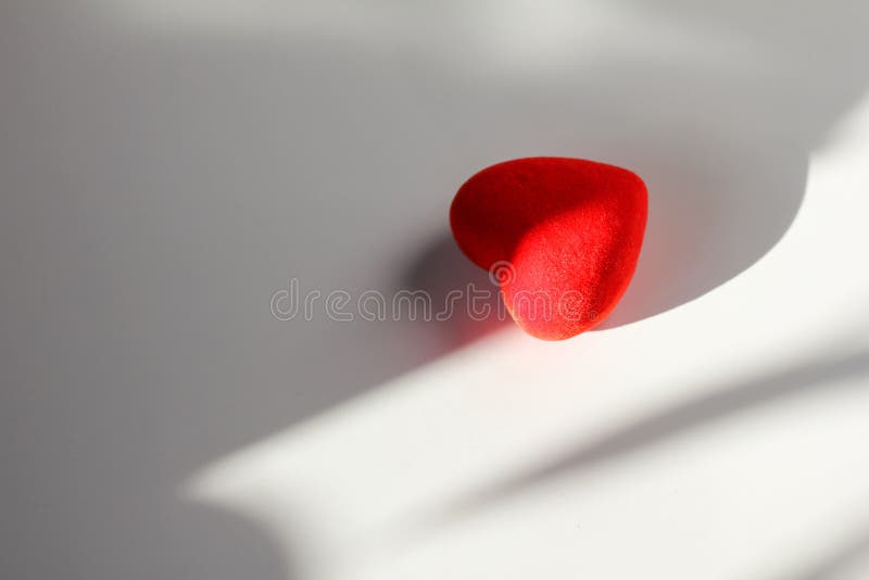 Decorative Red Heart on a White Background with Sun Rays and Shadow ...