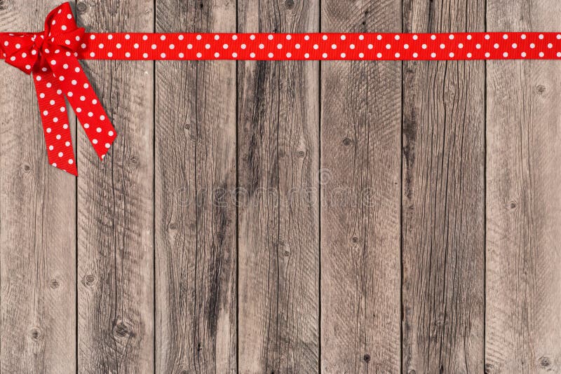 Decorative Red Ribbon on the Old Wooden Table. Stock Image - Image of ...