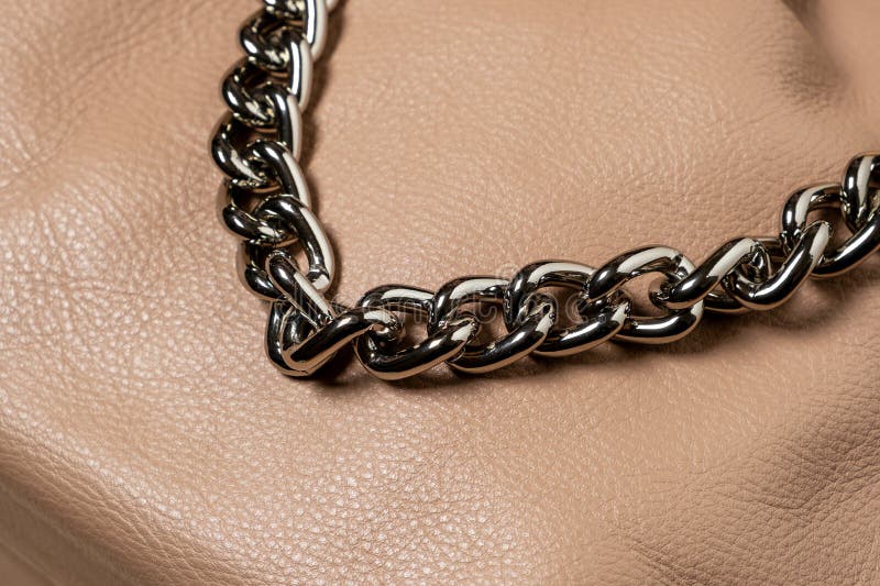 Decorative Shiny Chain on Brown Leather Stock Image - Image of luxury ...