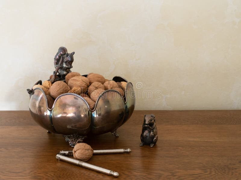 Decorative Silver Bowl and Nutcracker with Mixed Nuts in the Shell ...