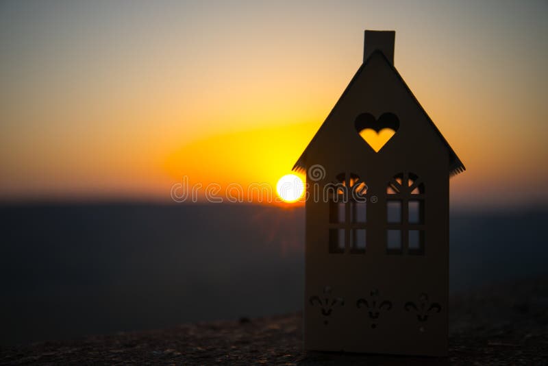 Decorative Small Metallic House on the Sunset Background. Stock Image ...
