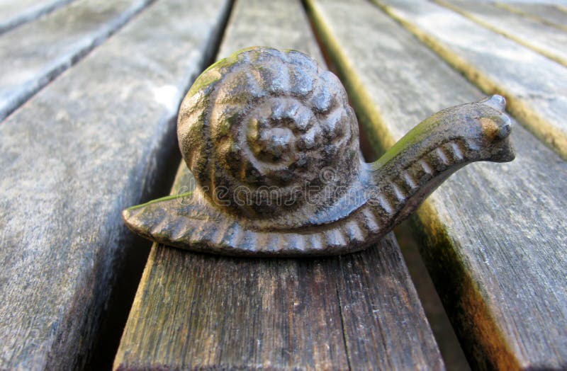 Decorative Snail on the Patio Table Stock Image - Image of closeup ...