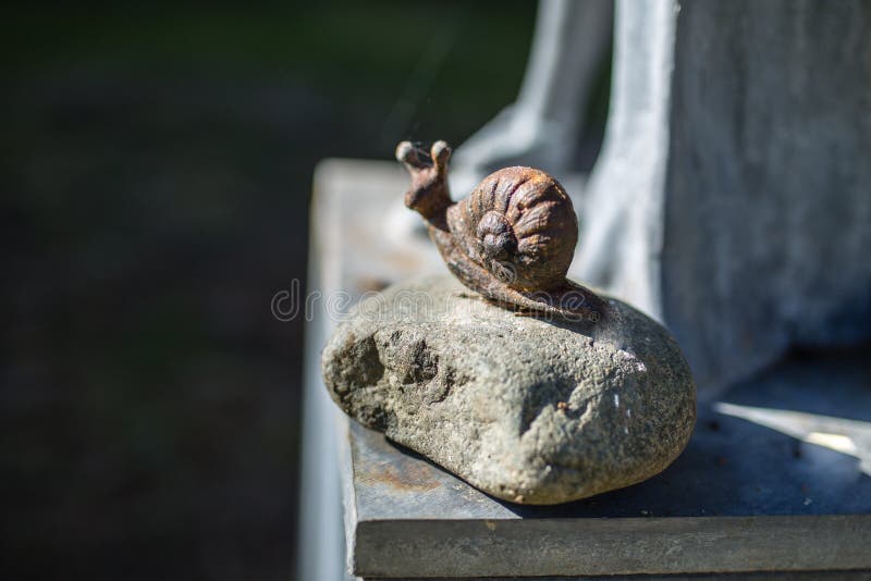 Decorative Snail on the Stone in the Garden Stock Photo - Image of ...