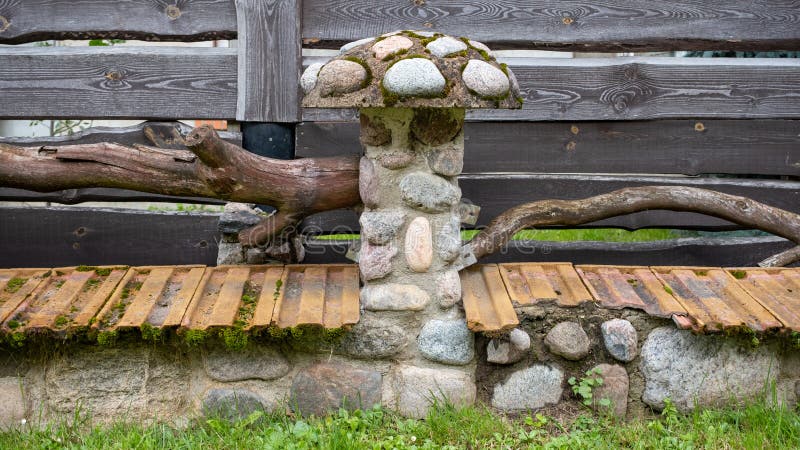 A Decorative Stone Fence Post for Delimiting a Private Area. Stock ...