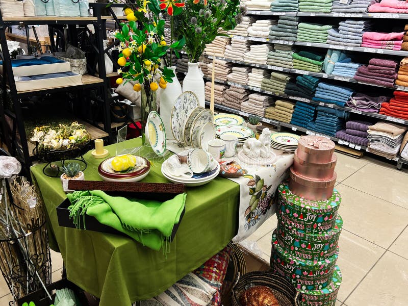 Decorative Table Display Surrounded by Colorful Linens and Stacked ...