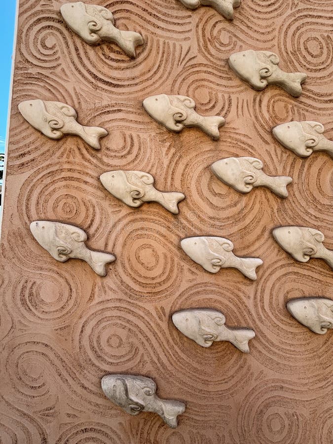 Decorative Wall Art Featuring Fish Sculptures in a Swirling Pattern ...